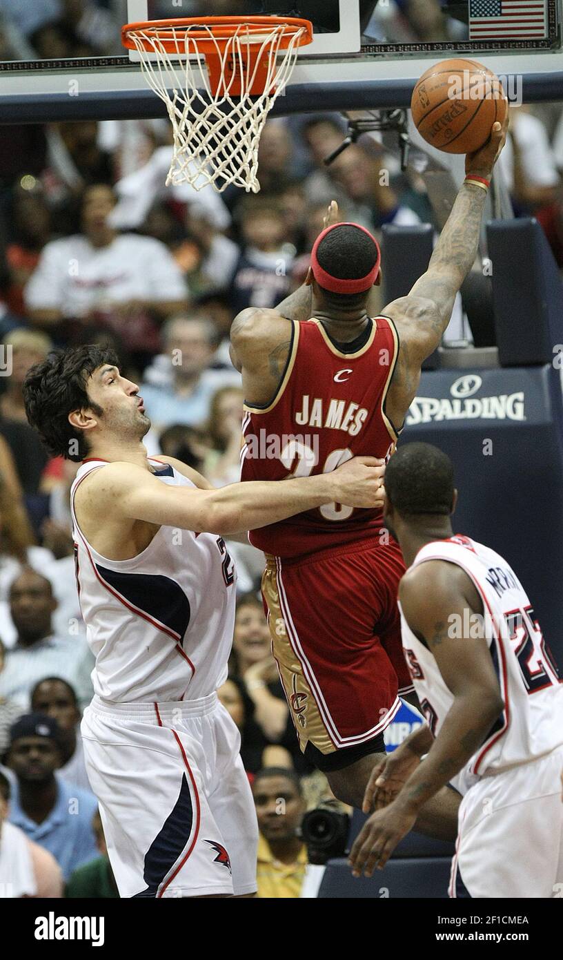 Cleveland Cavaliers forward LeBron James drives through a double team ...