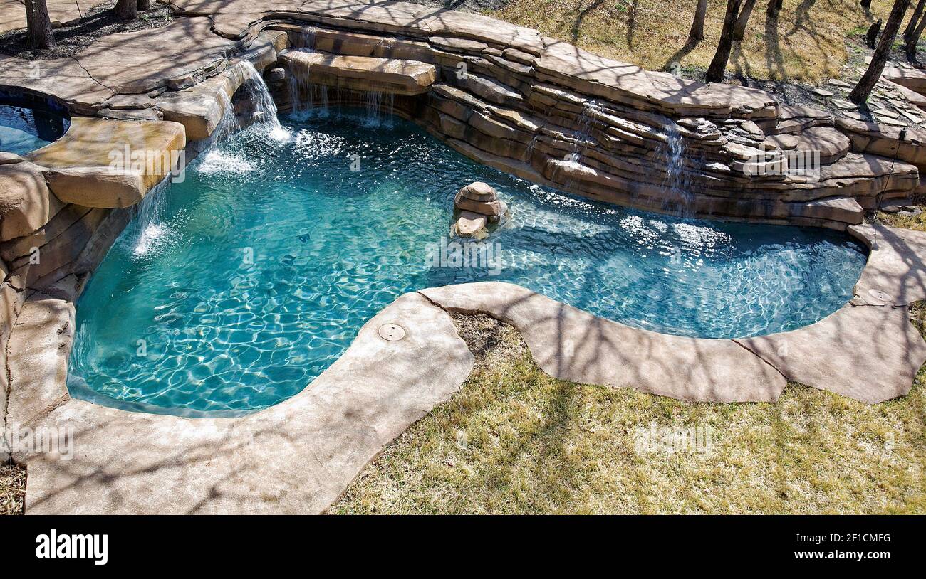 Beau Bradley of Rockscapes designed this distinctive pool with waterfalls that run year-round ...