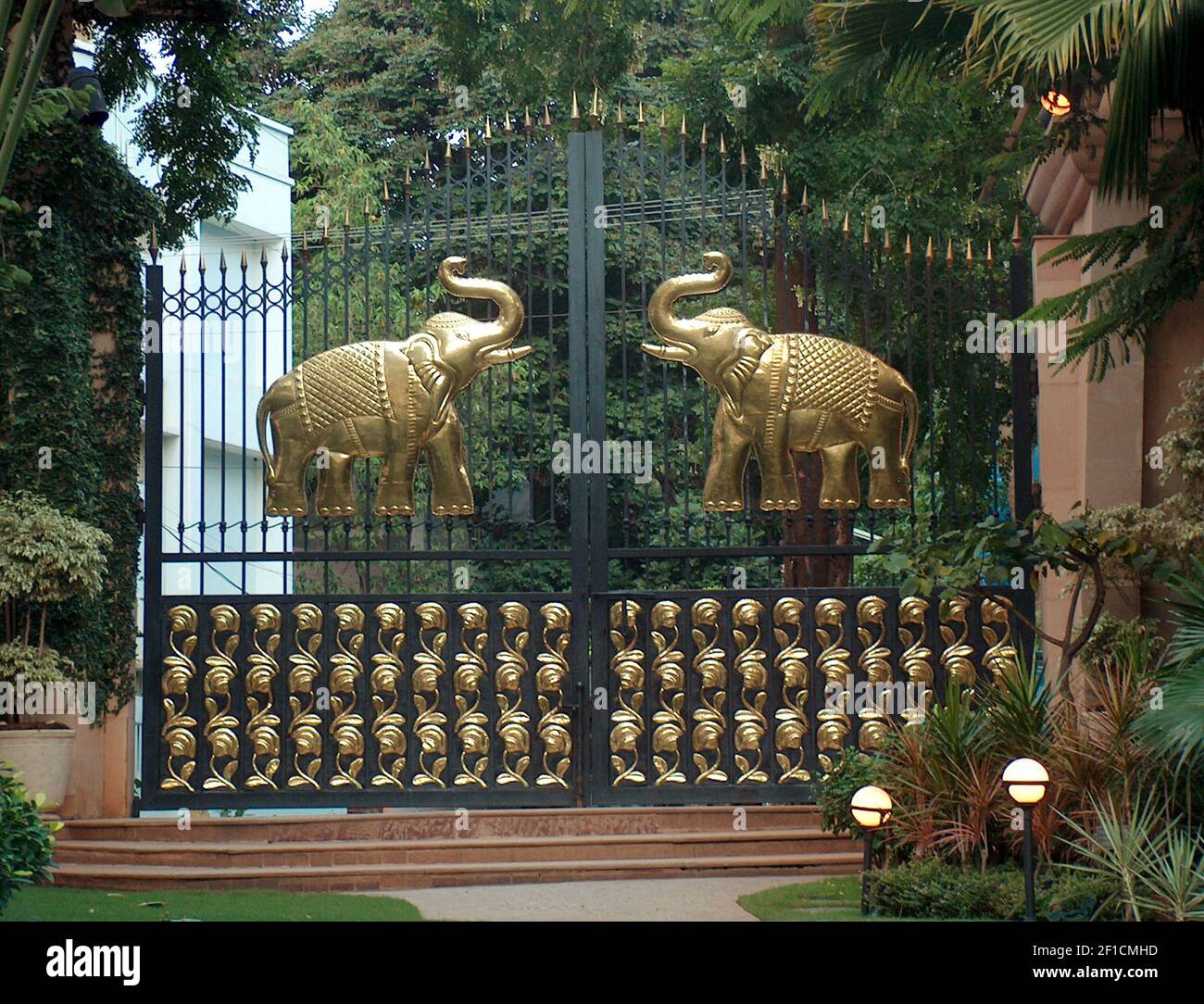 A winding path leads to an ornate elephant gate at one end of the ...