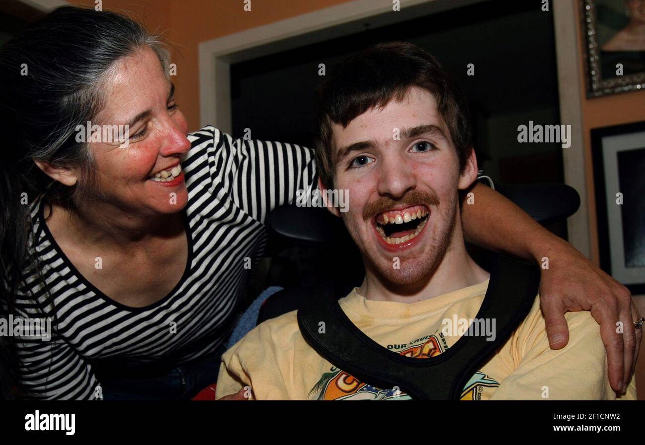 Claire Arbogast hugs her son Jessie at their home in Ocean Springs ...