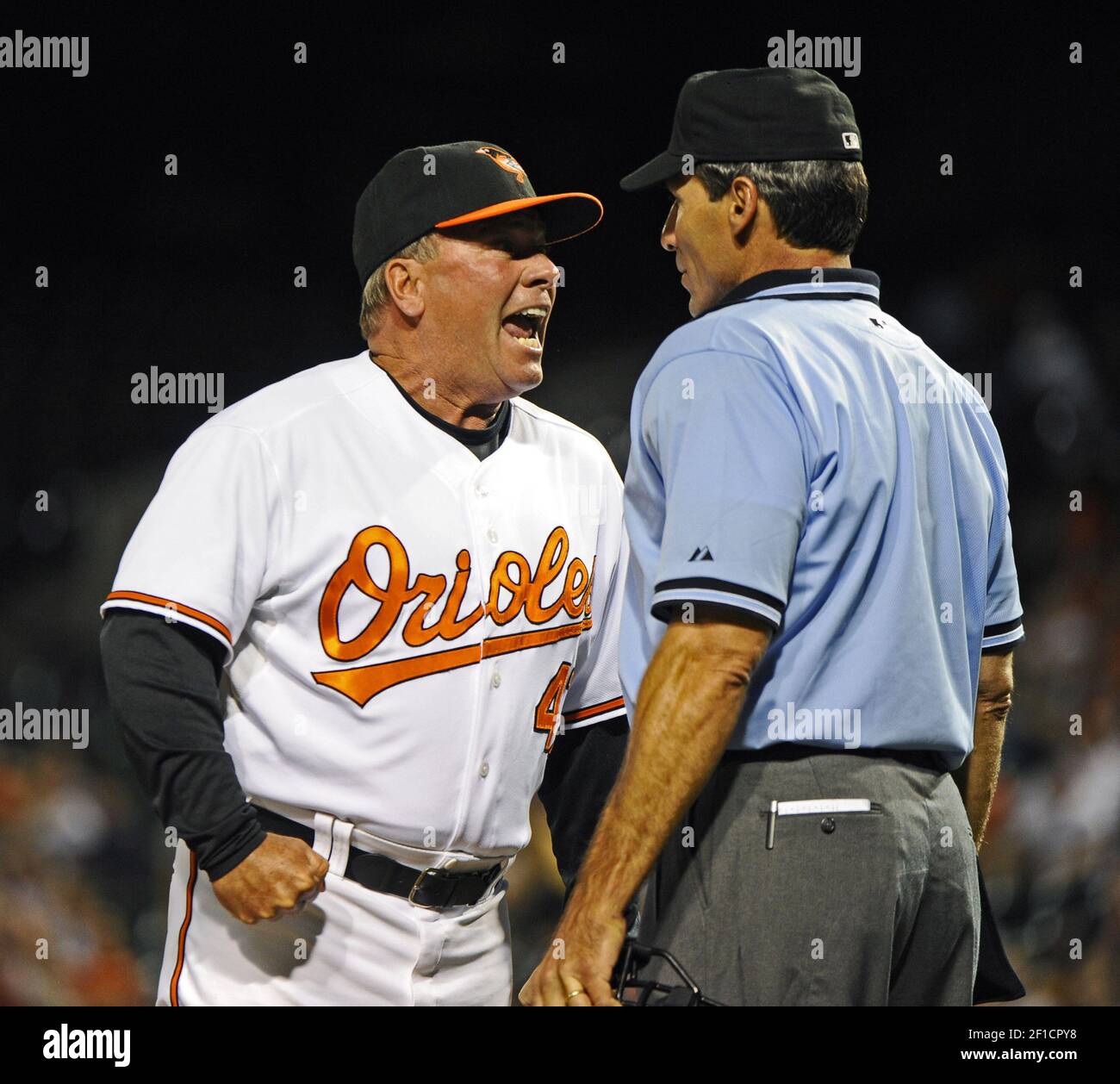 Baltimore Orioles manager Dave Trembley, left, argues with home plate ...