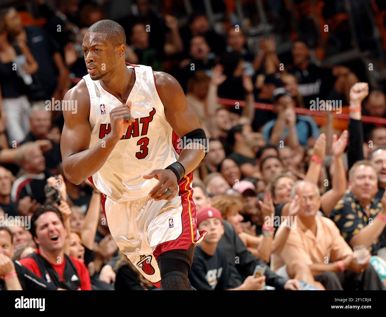 Miami Heat's Dwyane Wade reacts after hitting a three pointer in Game 3 ...