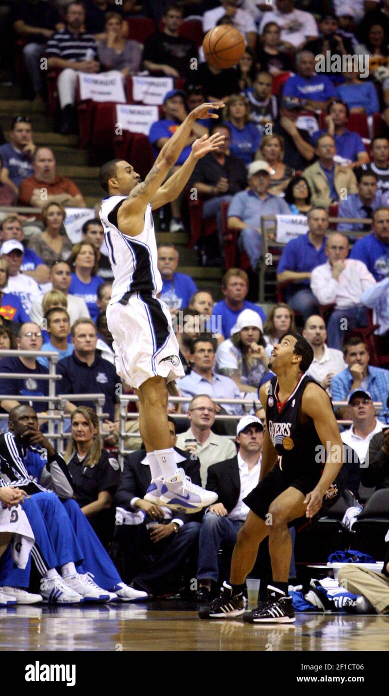 The Orlando Magic's Courtney Lee, left, shoots over the Philadelphia ...