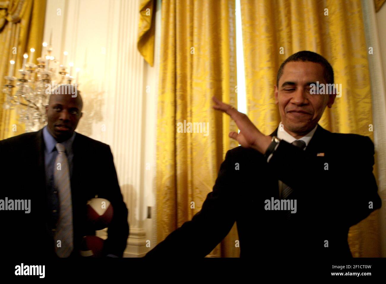 President Barack Obama, right, trailed by his assistant Reggie Love ...