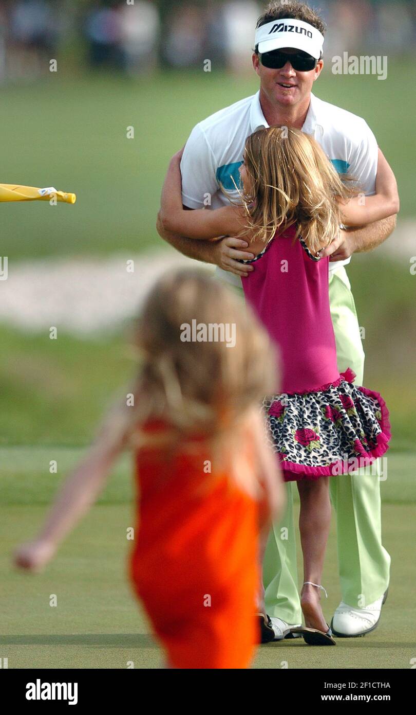 Brian Gay gets a hug from his daughter McKinley after sinking his putt ...