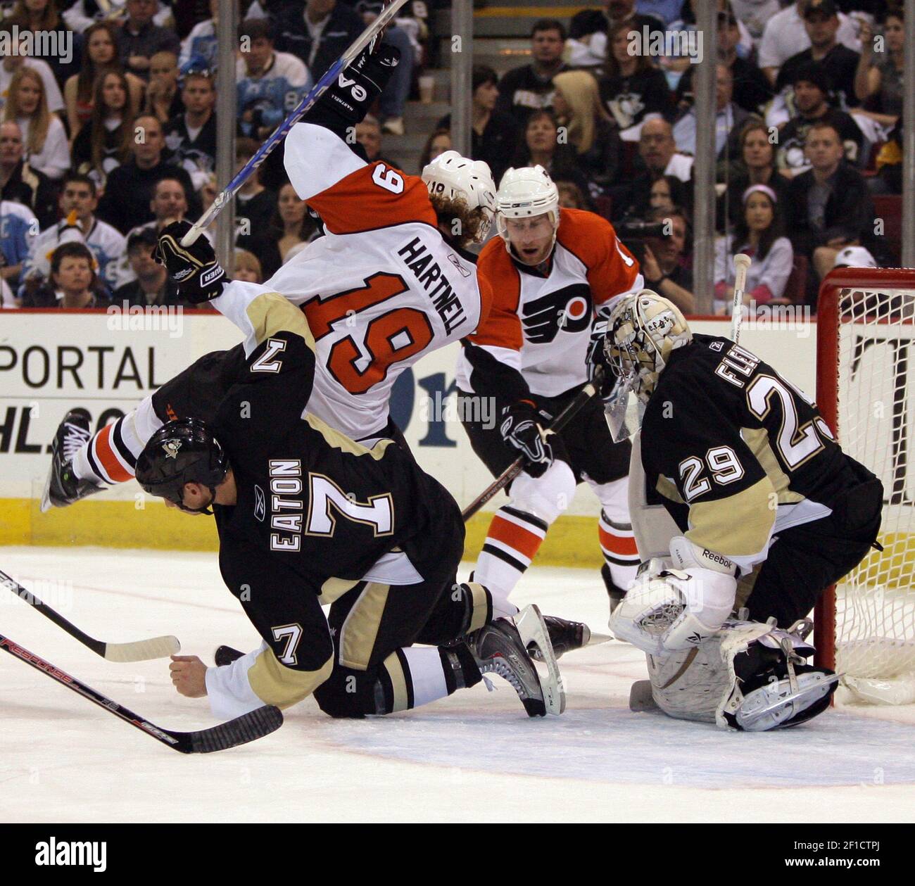 Philadelphia Flyers' Scott Hartnell falls over Pittsburgh Penguins ...