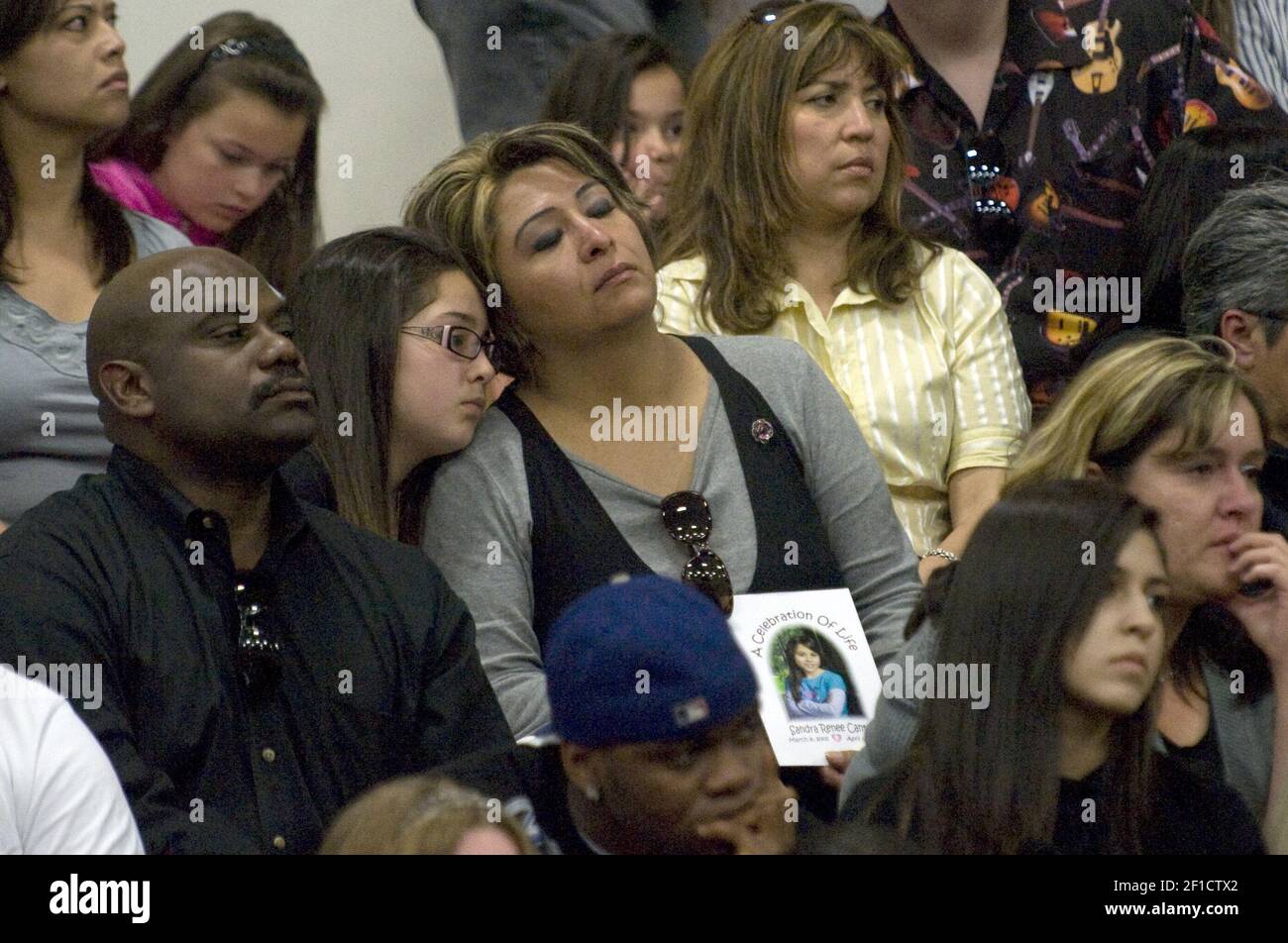 Mourners listen during a memorial service for 8-year-old Sandra Cantu ...