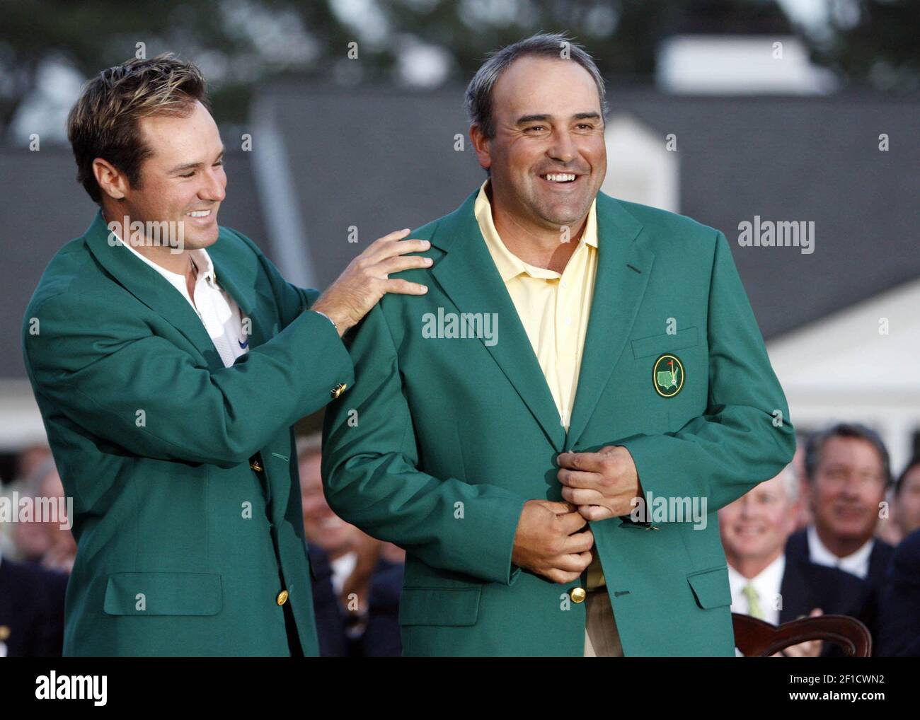 2008 Masters Champion Trevor Immelman, left, put the green jacket on ...