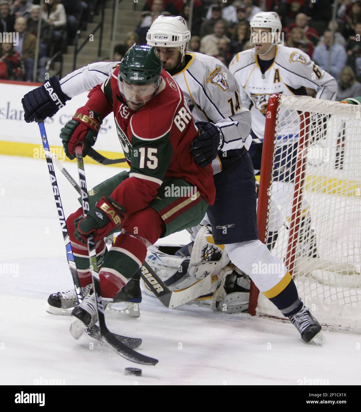 Minnesota Wild's Andrew Brunette (15) worked his way toward the net ...