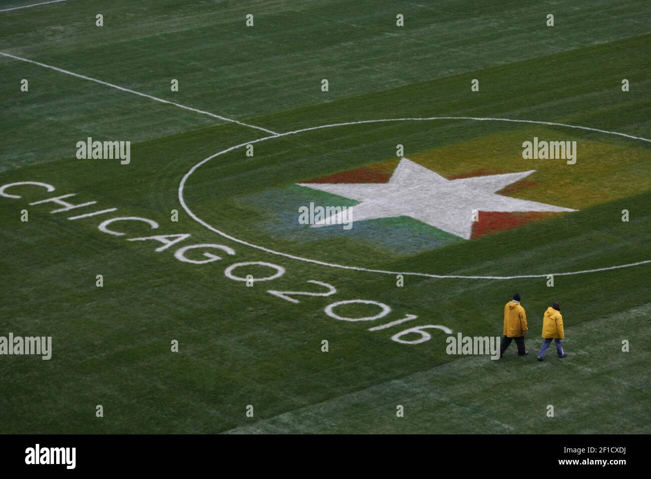Workers walk near the Chicago 2016 logo at Soldier Field on Sunday ...