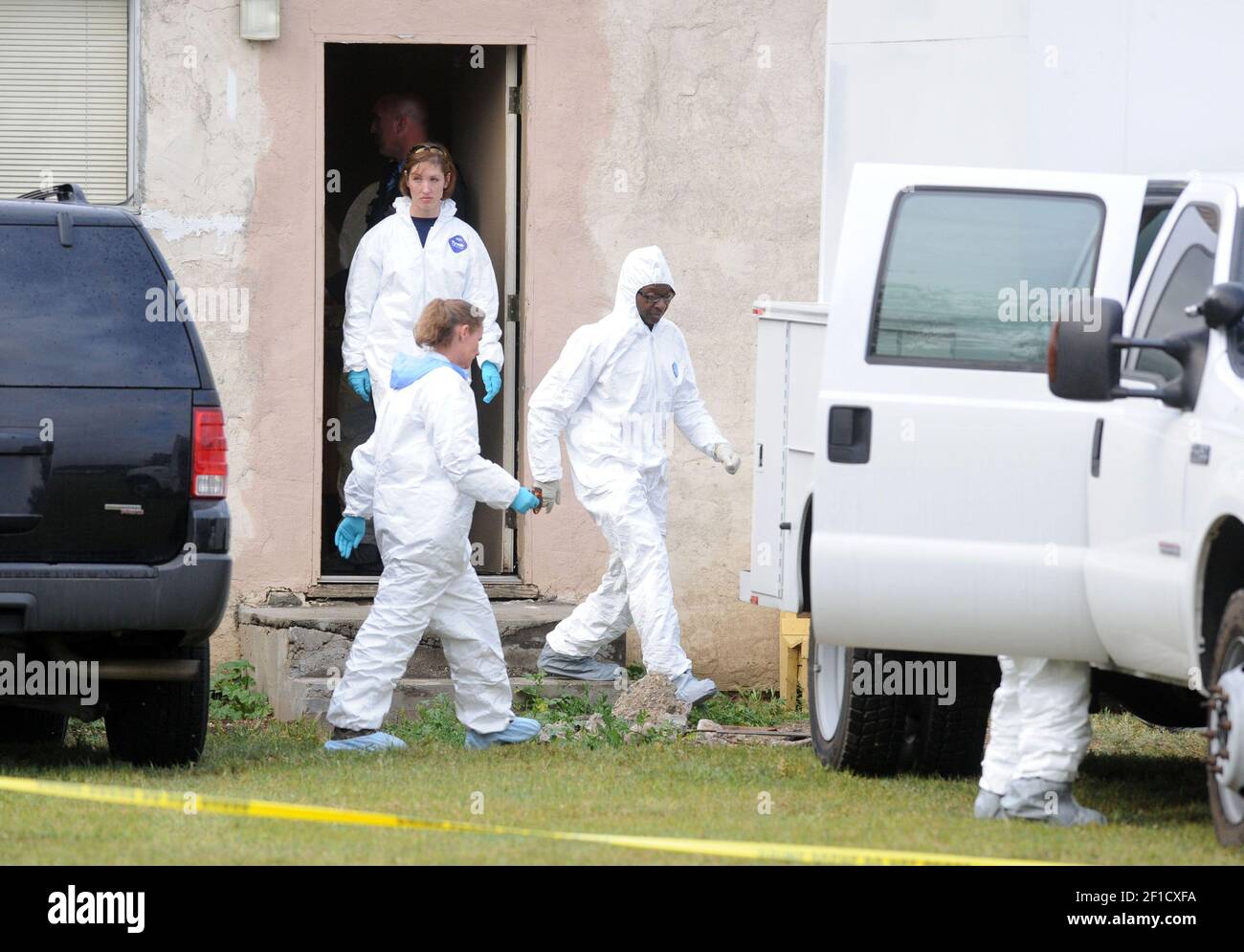 Members of the FBI get ready to look for evidence in connection to the ...