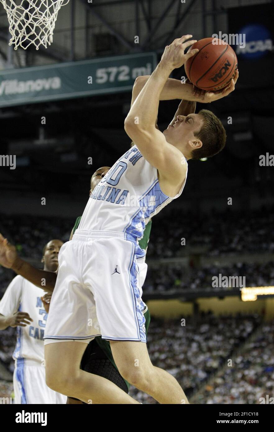 North Carolina's Tyler Hansbrough (50) gets tied up by Michigan State's ...
