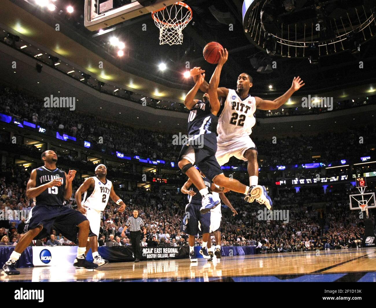 Villanova's Corey Fisher is fouled by Pittsburgh's Brad Wanamaker late ...