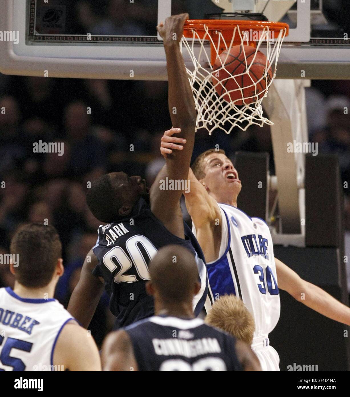 Villanova's Shane Clark dunks the basketball over Duke's Jon Scheyer ...