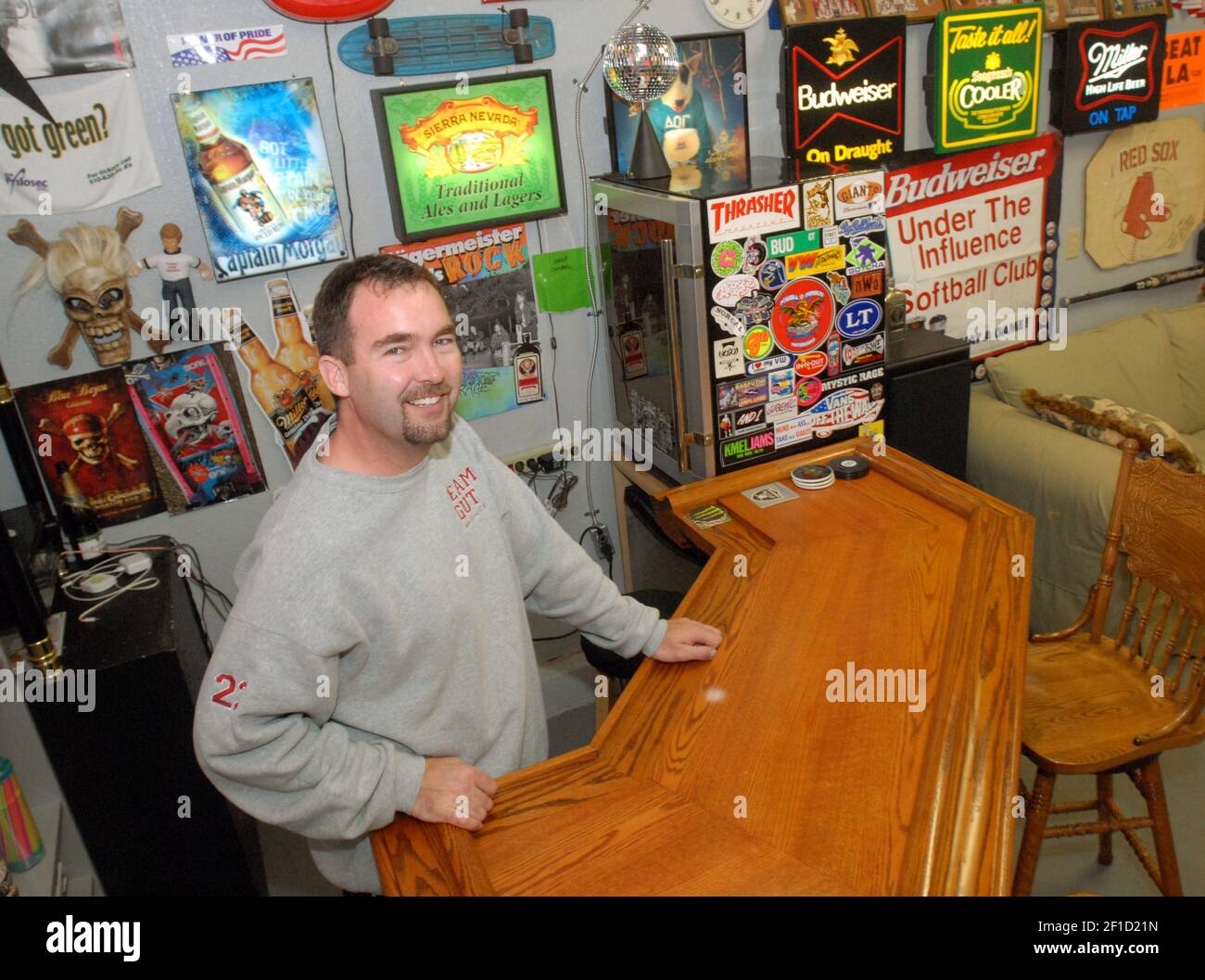 Dave Baker, of Dublin, California, is behind the bar in his "man cave ...
