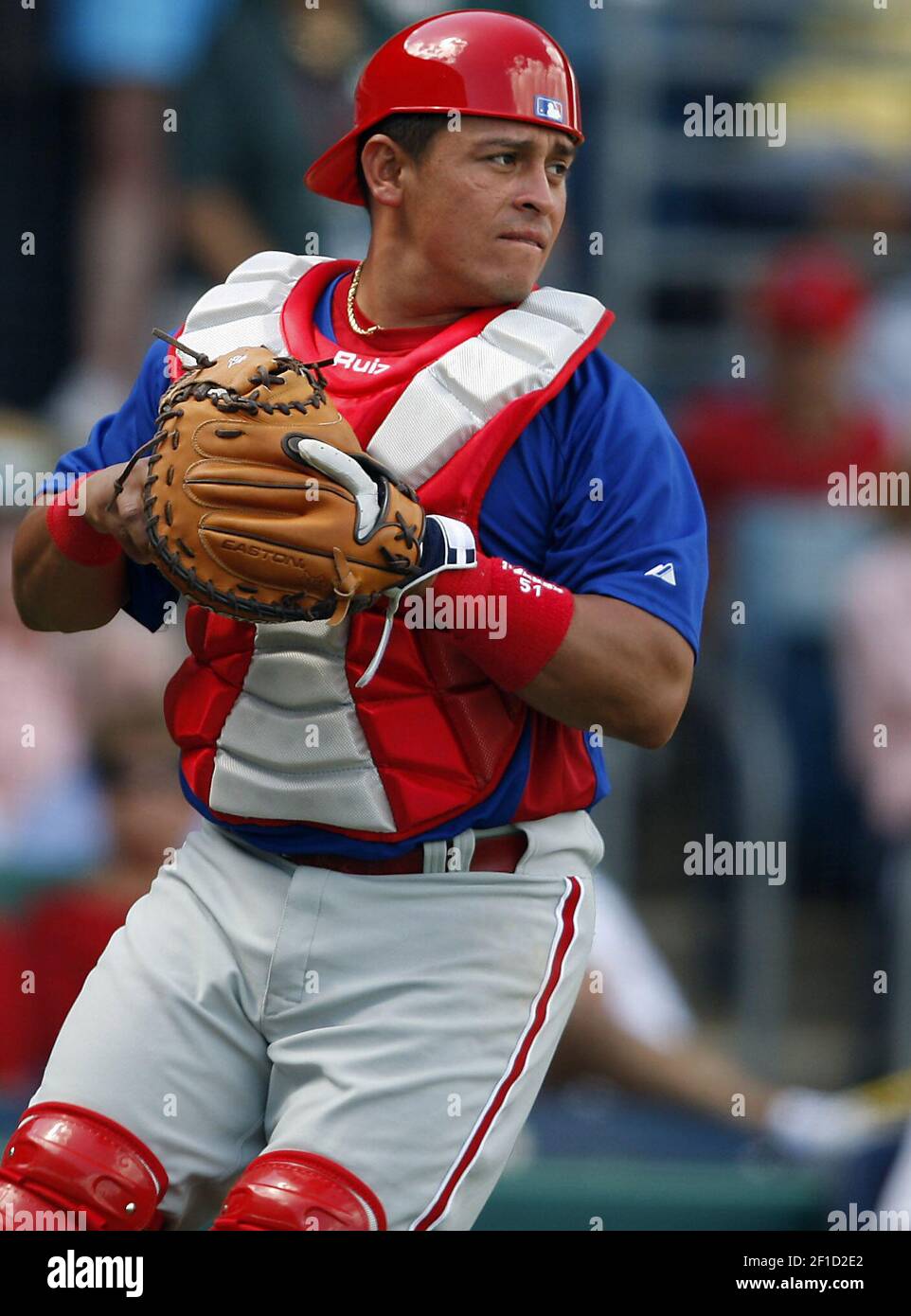 Carlos Ruiz looks back to the pitcher after catching a foul ball in the ...