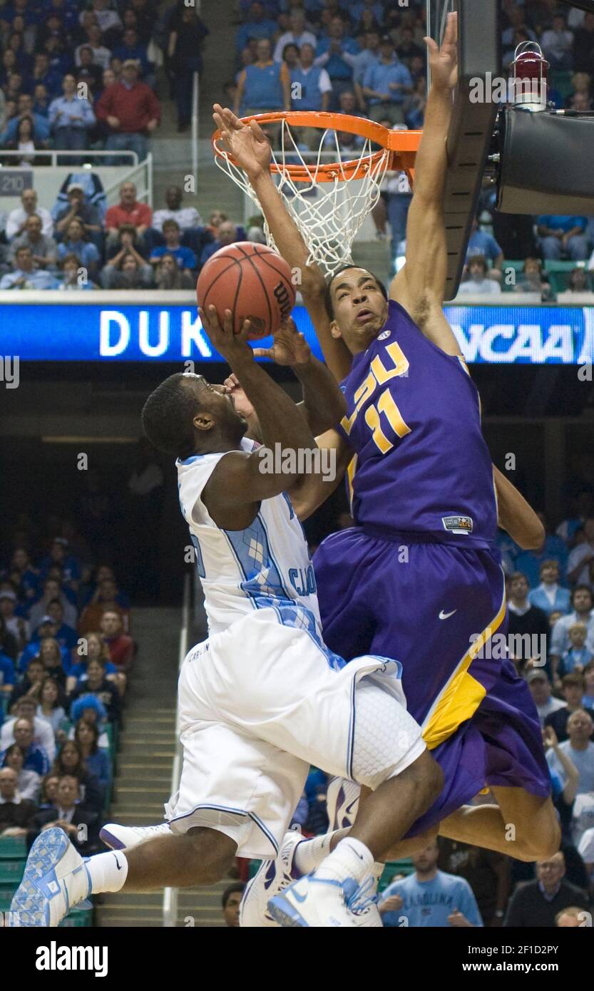 Ty Lawson of North Carolina goes for a shot against Bo Spencer of LSU ...