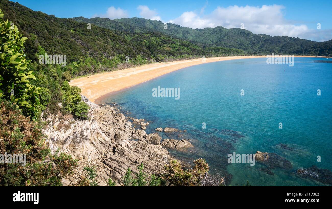 View on the tropical beach with golden sands and azure waters ...