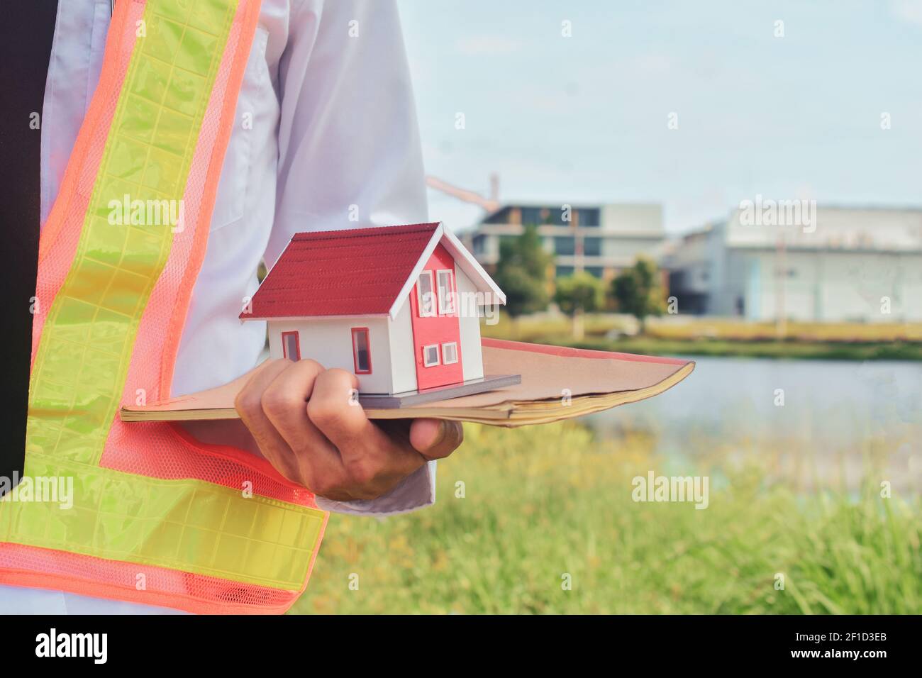 close up engineer holding house model for design house building ...