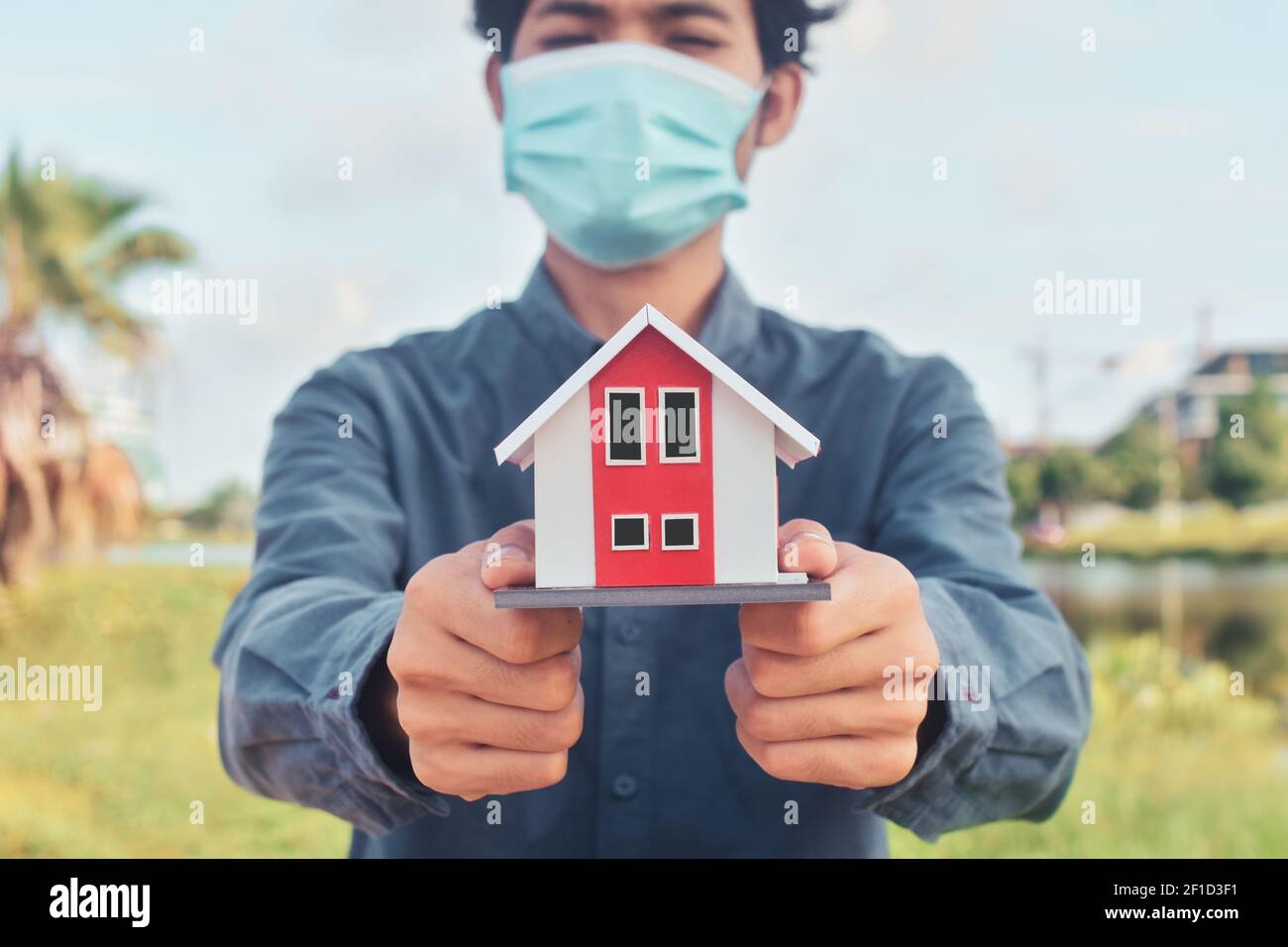 Man holding house for sale business rent resident finance Stock Photo ...