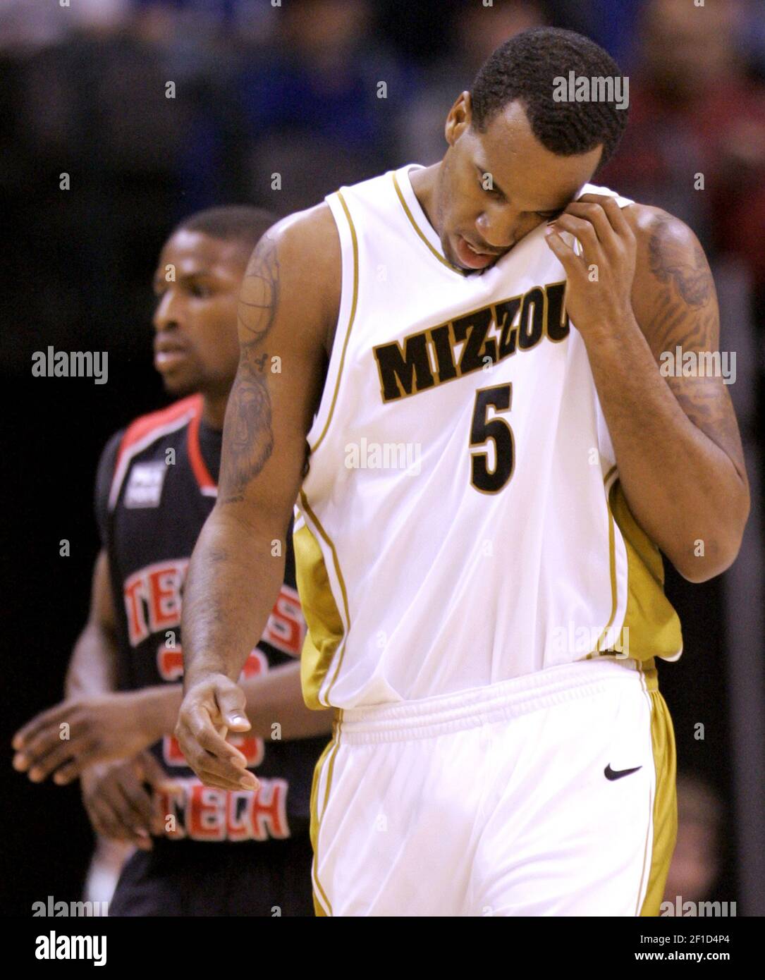 Missouri forward Leo Lyons (5) wiped some sweat from his brow during a ...