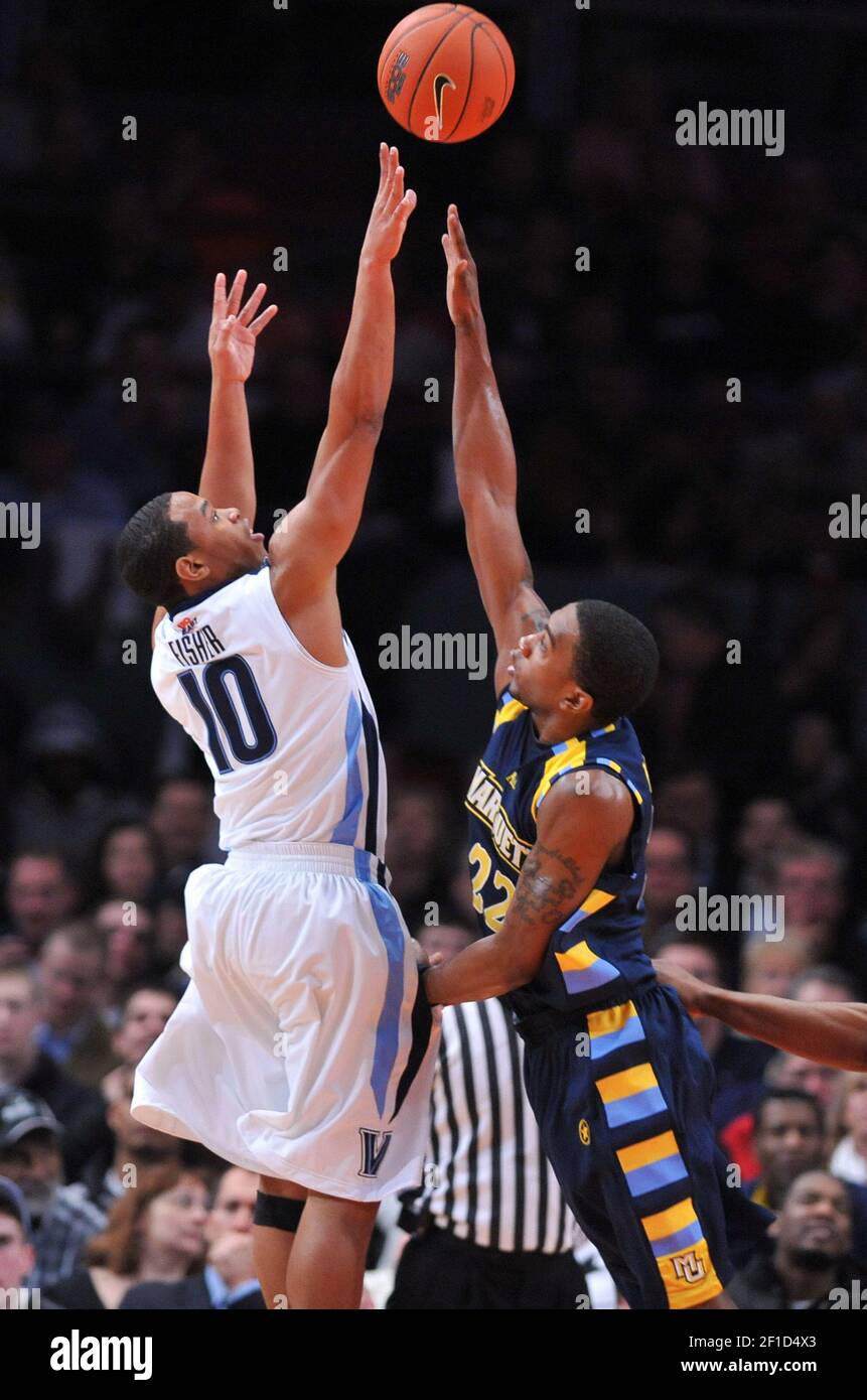 Villanova's Corey Fisher shoots over Marquette's Jerel McNeal in the ...