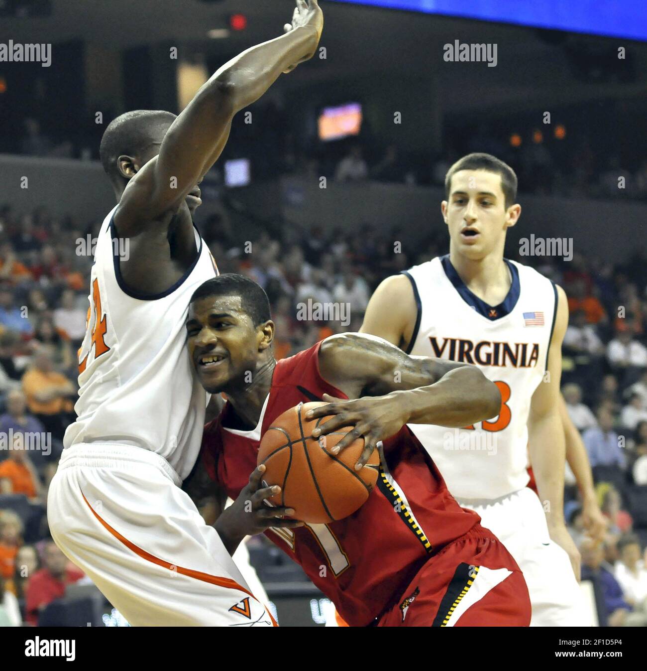 Maryland forward Landon Milbourne (1) runs into the chest of Virginia ...