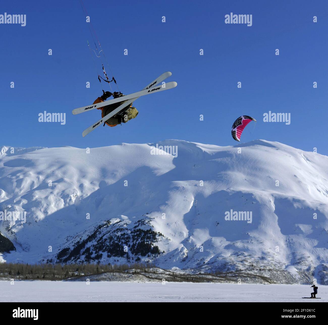 Tom Fredericks performs aerial tricks while snowkiting with Obadiah ...