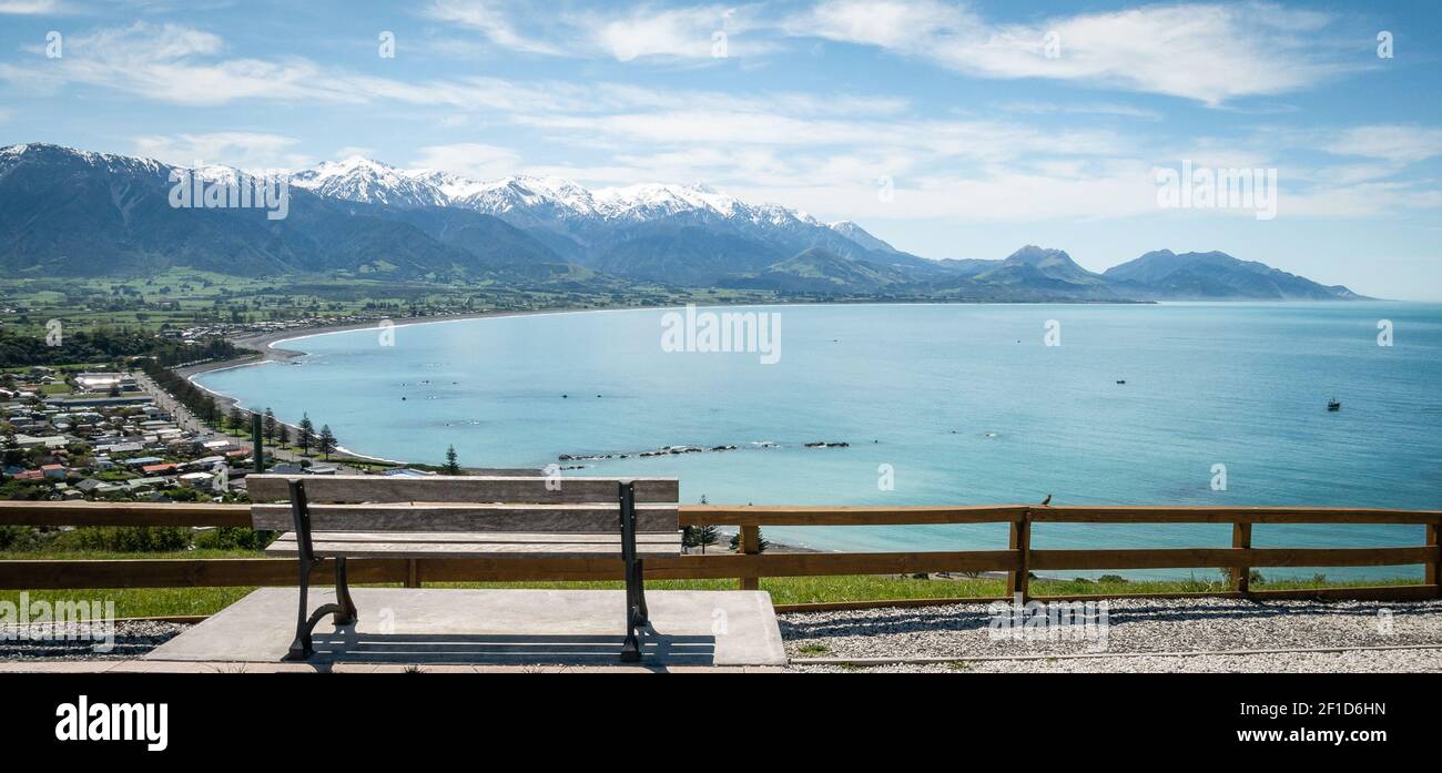Beautiful vista shot of coastal town with azure waters, mountains in ...