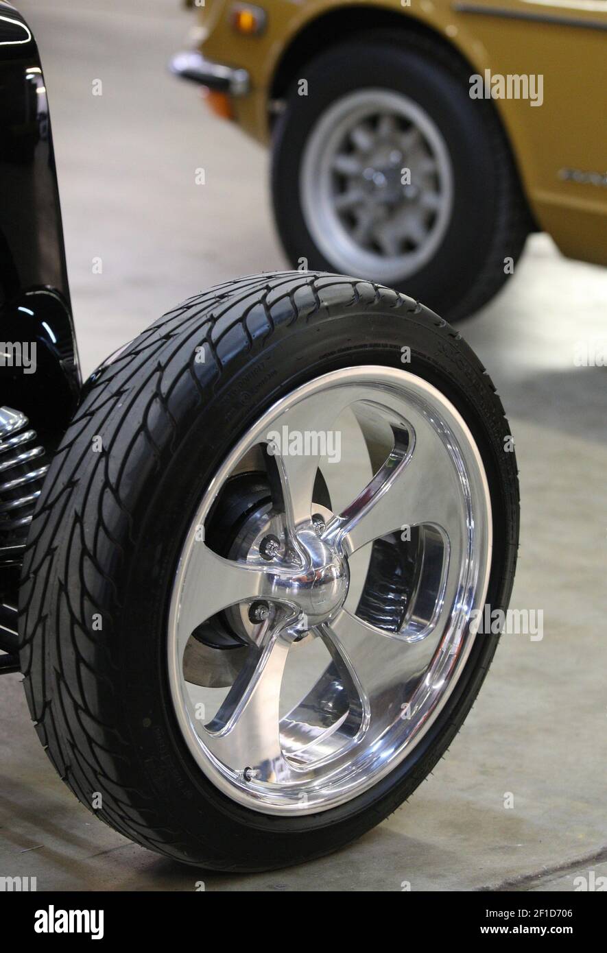 At Kustom Classics, two wheel designs years apart, at left the front ...