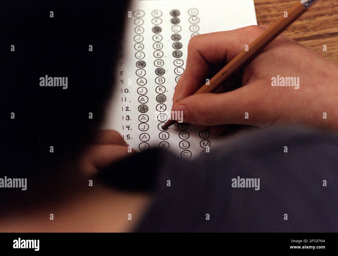 In this March 12, 1999 file photograph, a student fills in his answer ...