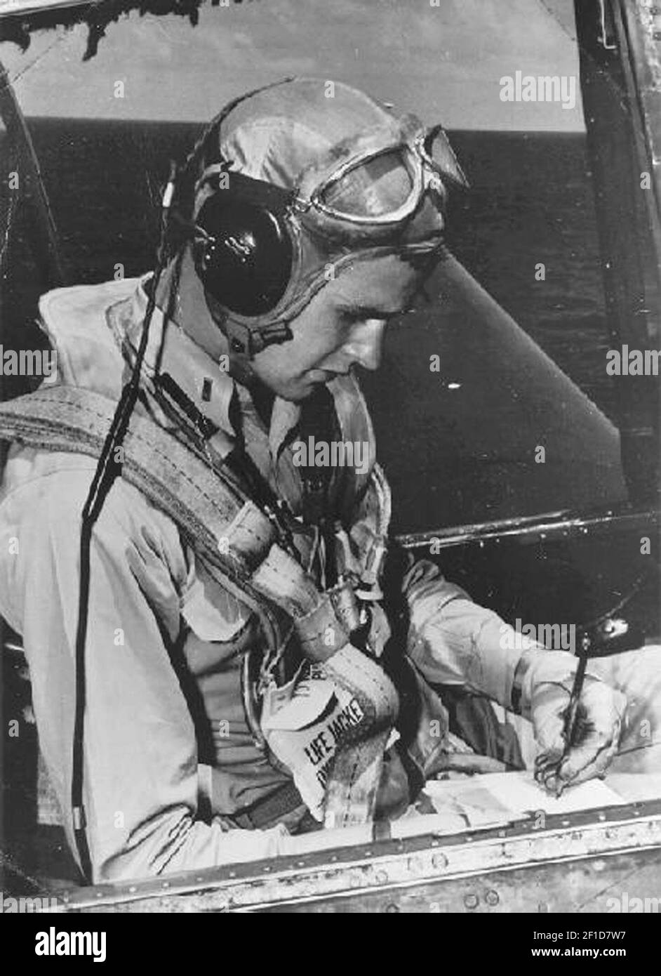 U.S. Navy pilot George Bush sits in the cockpit of an Avenger fighter ...