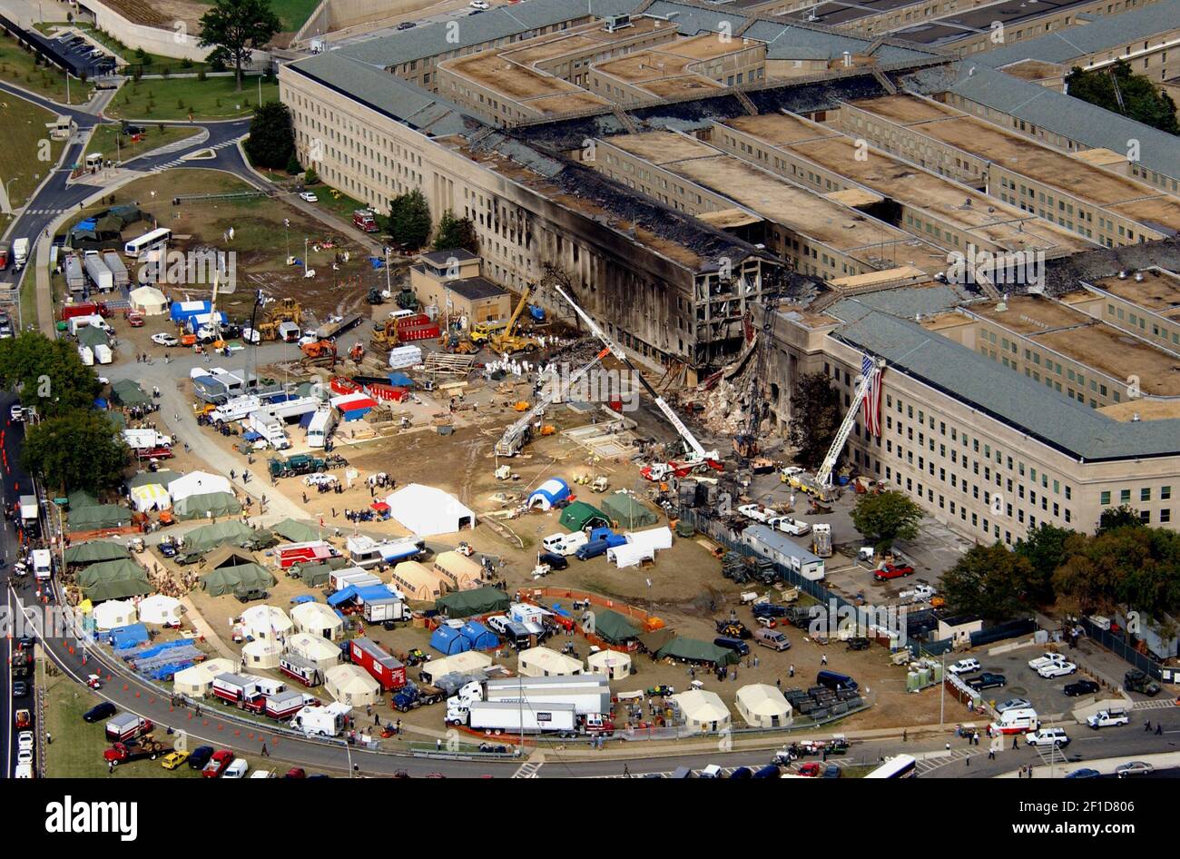 FBI agents, fire fighters, rescue workers and engineers work at the ...