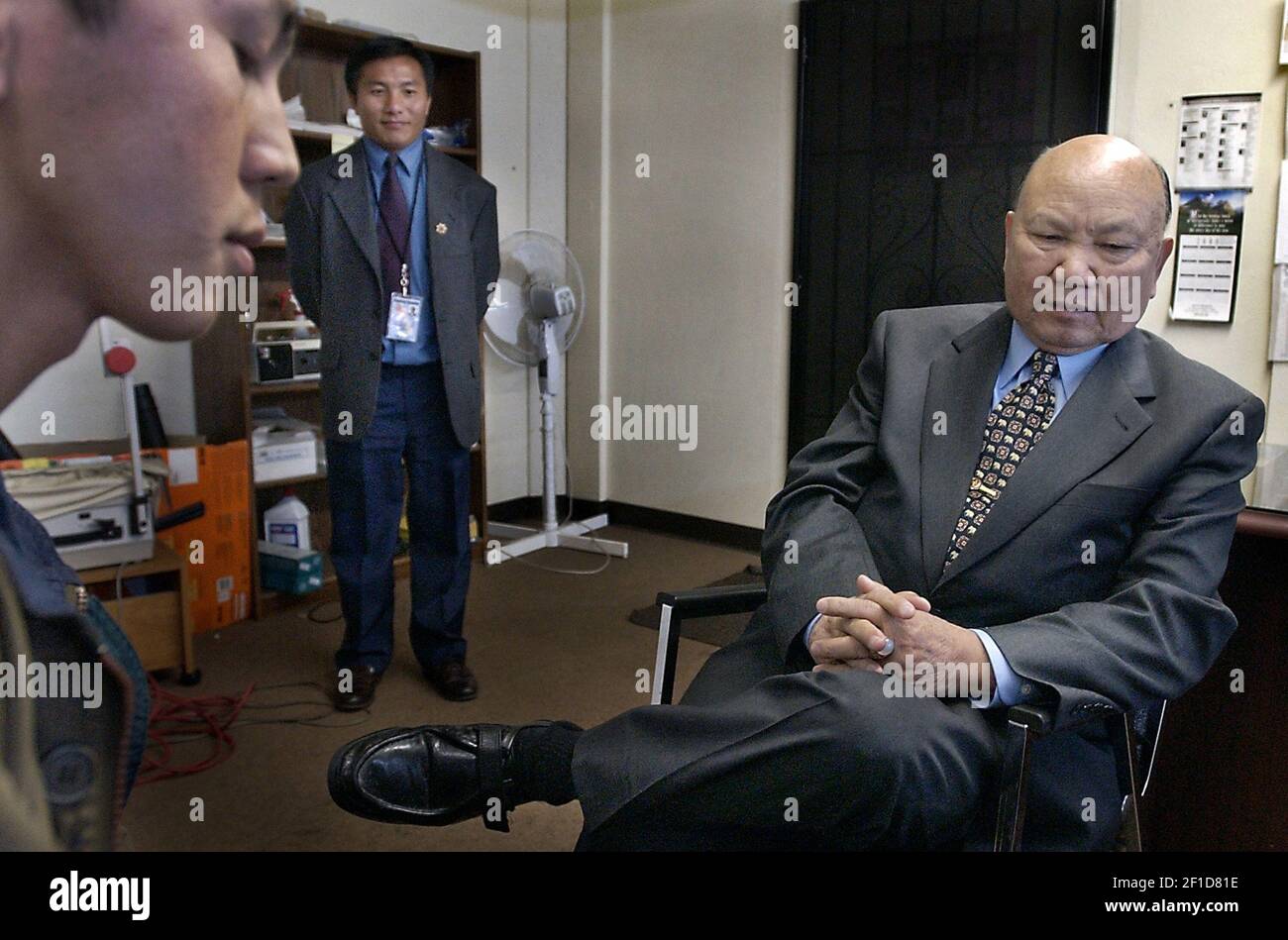 Legendary Hmong General Vang Pao, right, surrounded by his interpreter ...