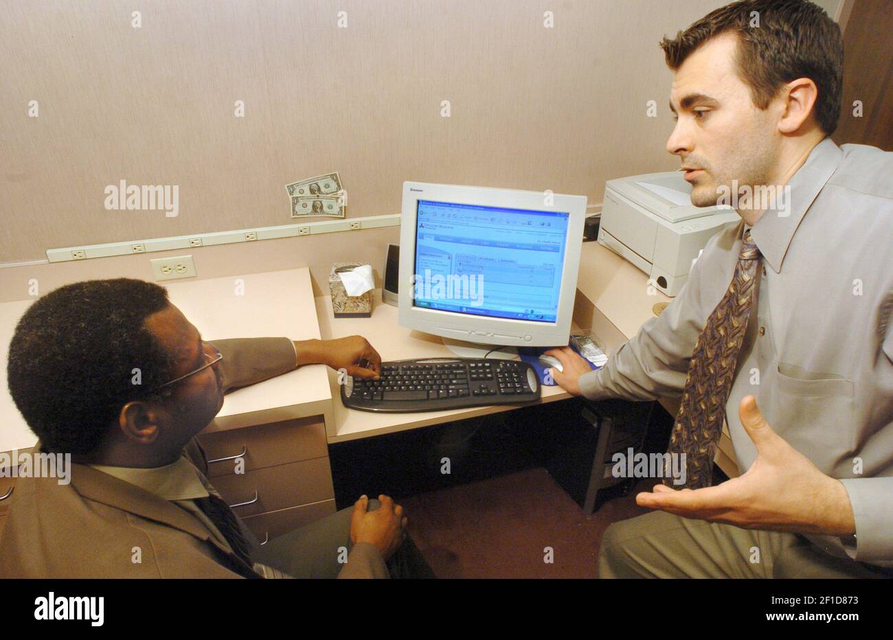 Dr. Charles Batson, left, and his office manager John Krogh demonstrate ...