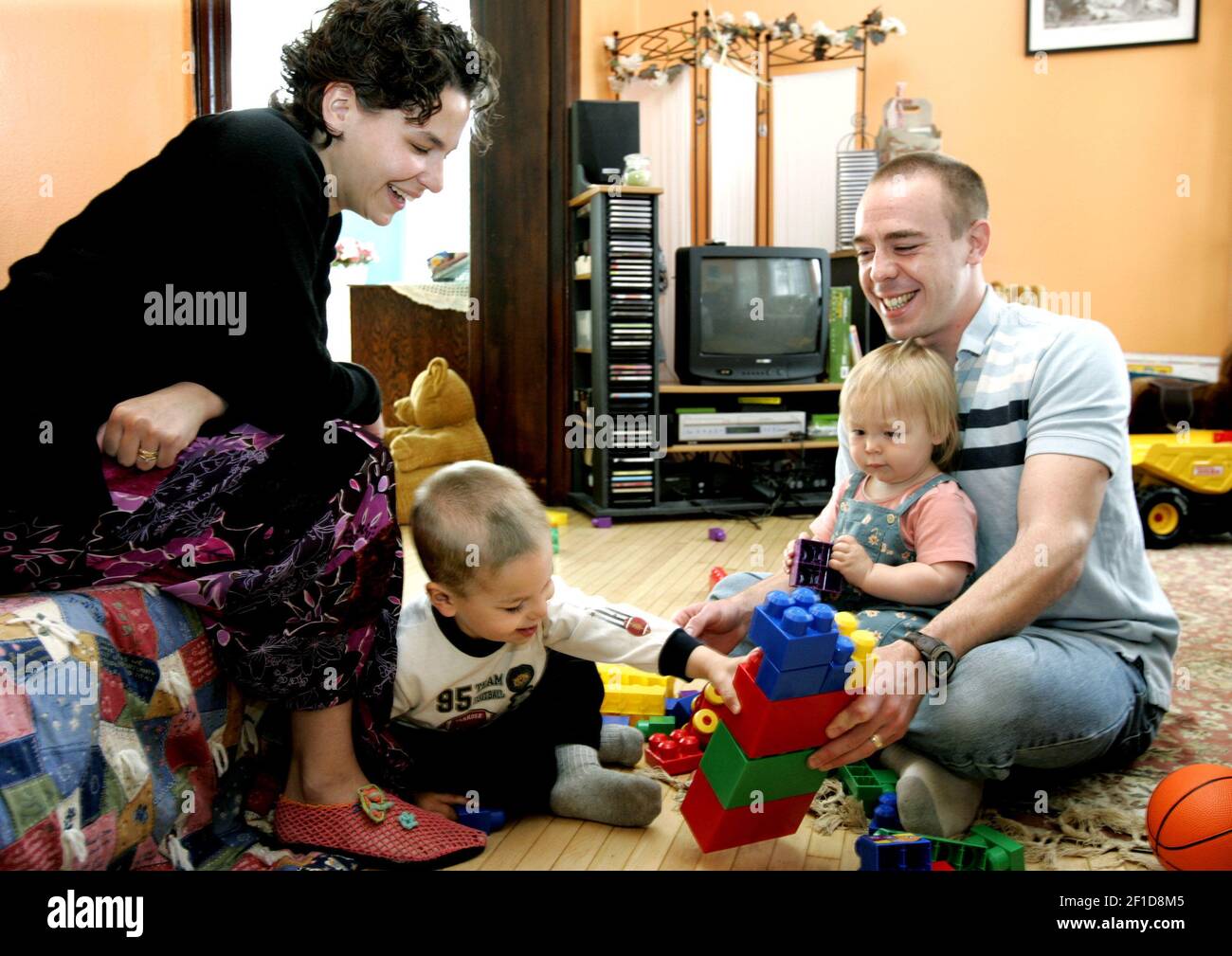 Christine Schulz, left, and her husband Joshua Schulz, right, play ...