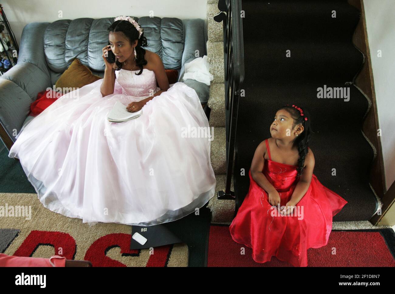 Maria Felix Fierros, 4, watches as her sister Ana Delia Fierros makes ...