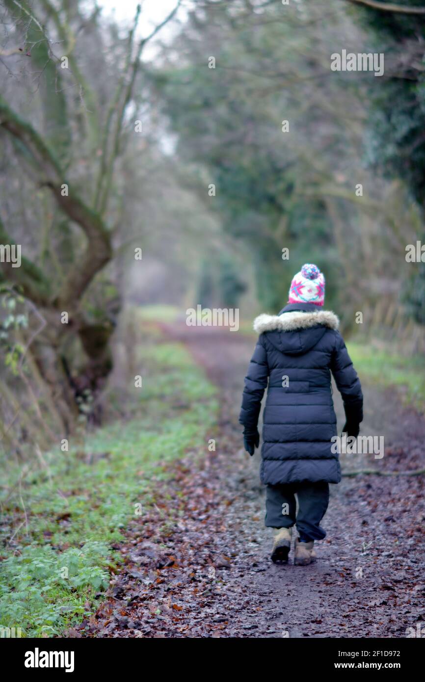 single older woman walking on cinder path in countryside broome norfolk ...