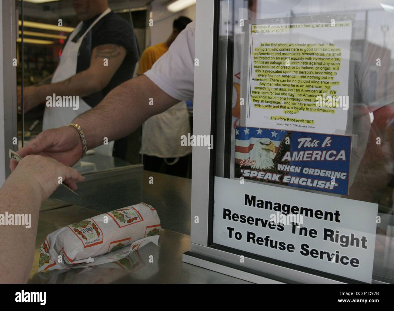 The "Speak English" signs at Geno's Steaks in South Philadelphia ...
