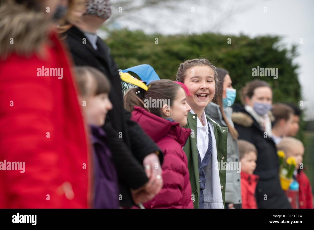 Chloe Wicks laughs with her friend Erin Stagle as they arrive at Thomas ...