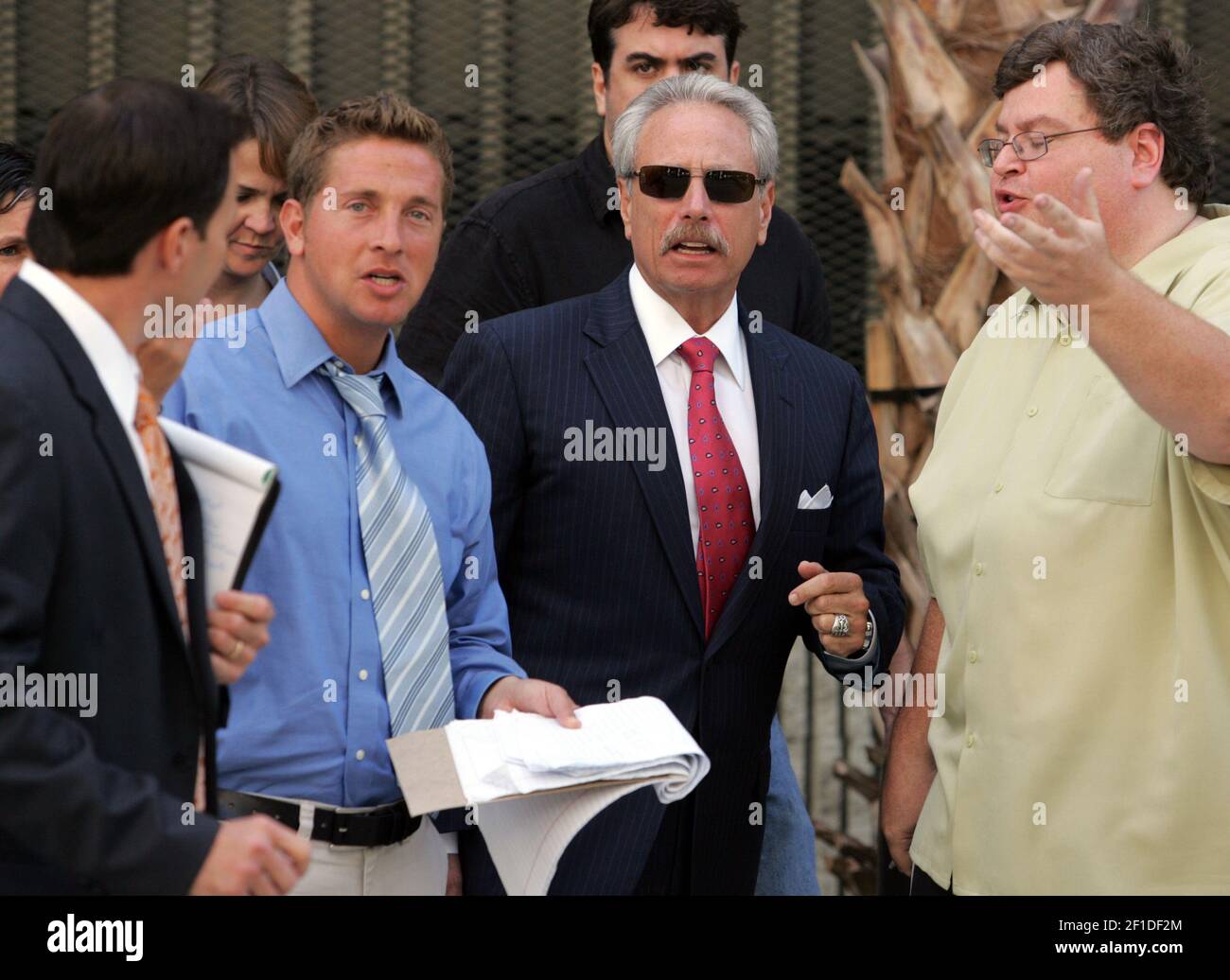 Marc Nurik (second from right), attorney for Scott Rothstein, leaves ...