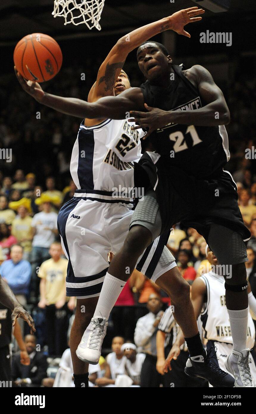 Providence forward Jamine Peterson (21) goes up and under George ...