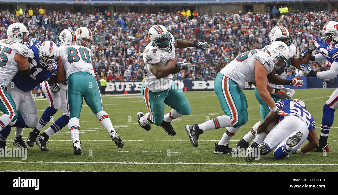 Miami Dolphins running back Ricky Williams scores a touchdown on a one ...