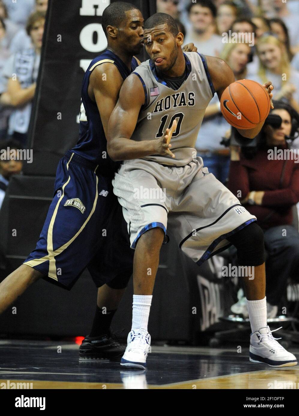 Georgetown center Greg Monroe (10) works the ball into the lane against ...