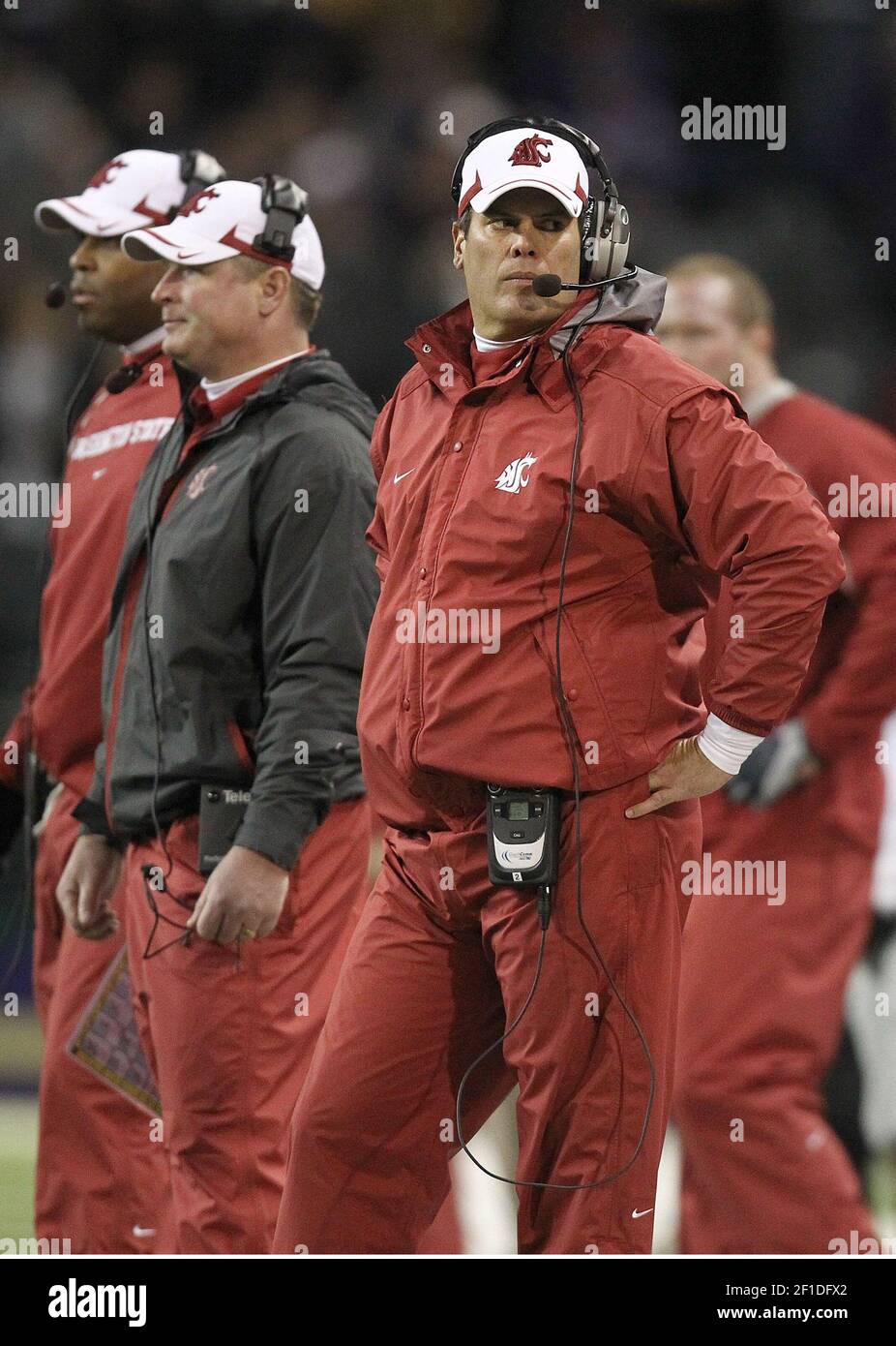 Washington State head coach Paul Wulff, right, looks on during a 30-0 ...