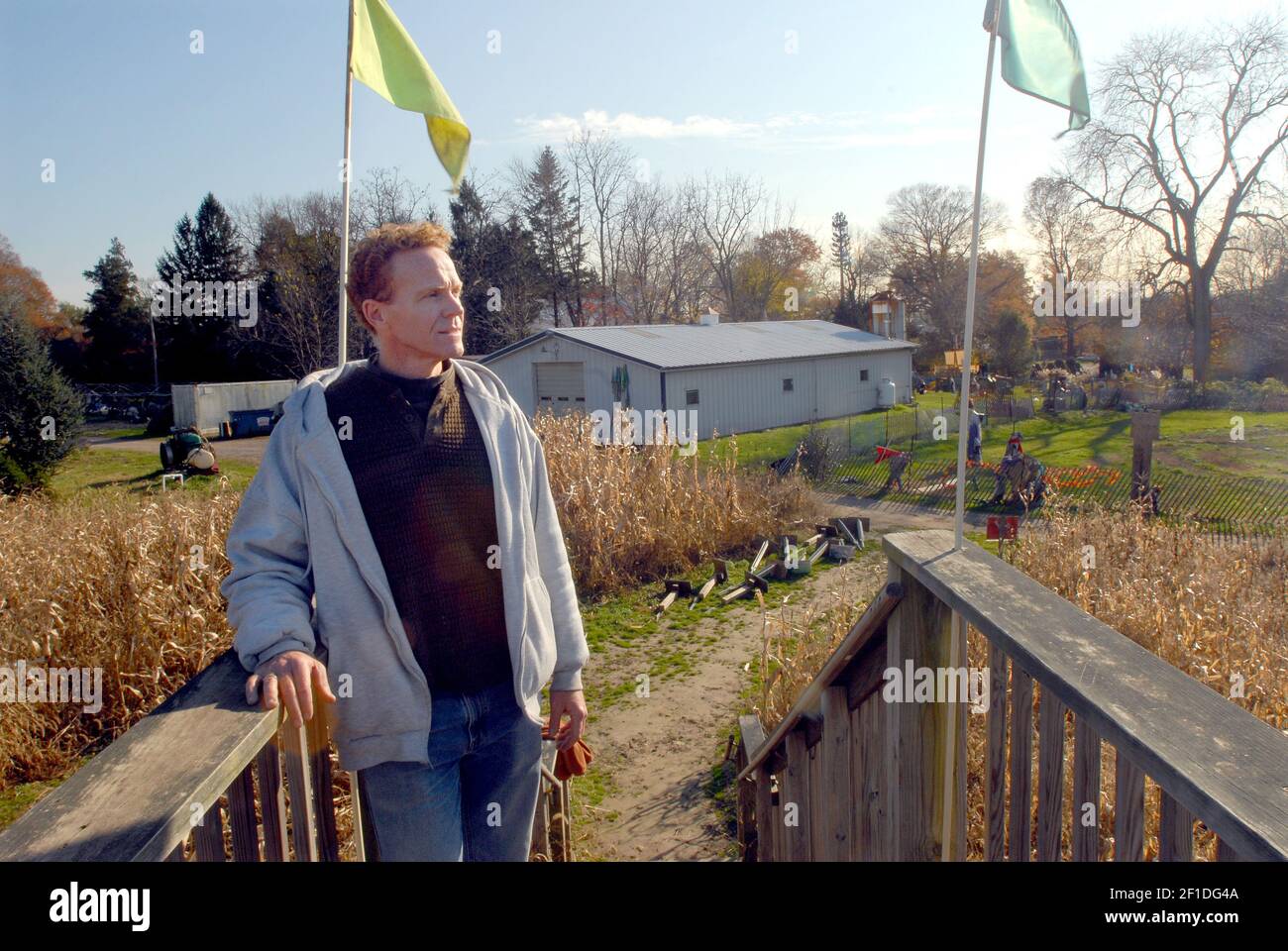 Jonathan Snipes stands on a bridge over the corn maze of the Falls ...