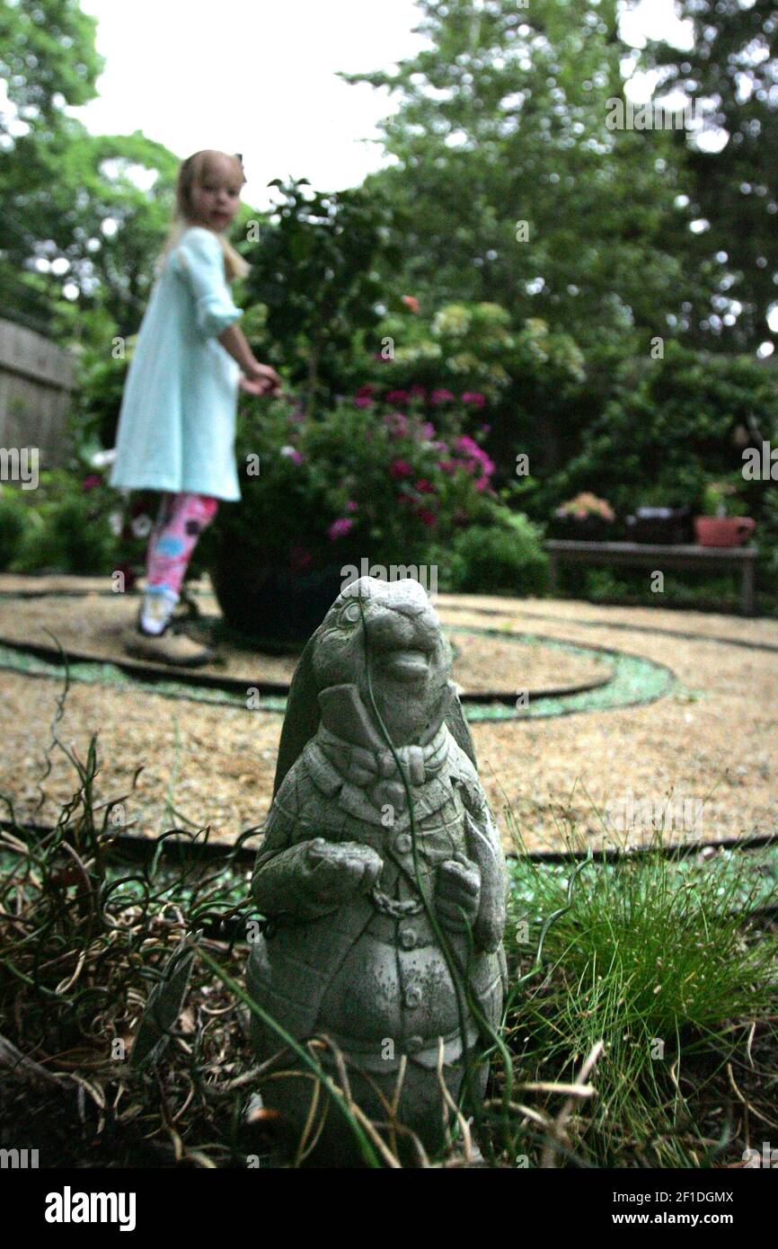 Natalie Bauder plays in her "Alice in Wonderland" garden in Wyndmoor ...
