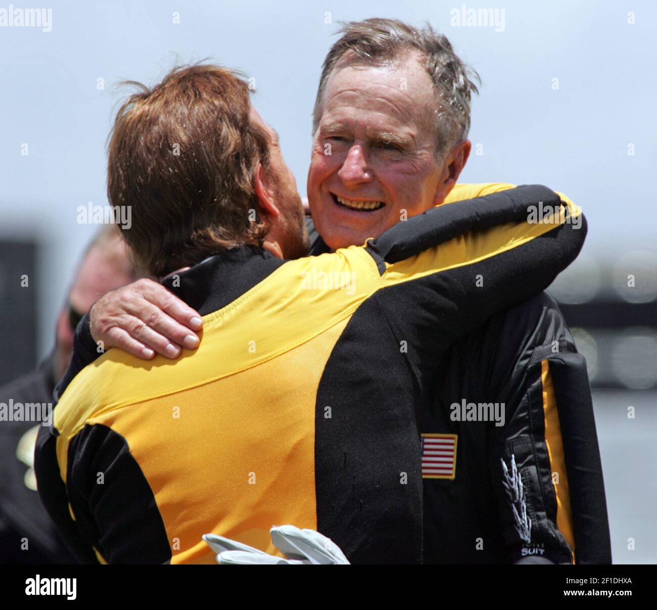 Former President George H. W. Bush hugs actor Chuck Norris after his ...
