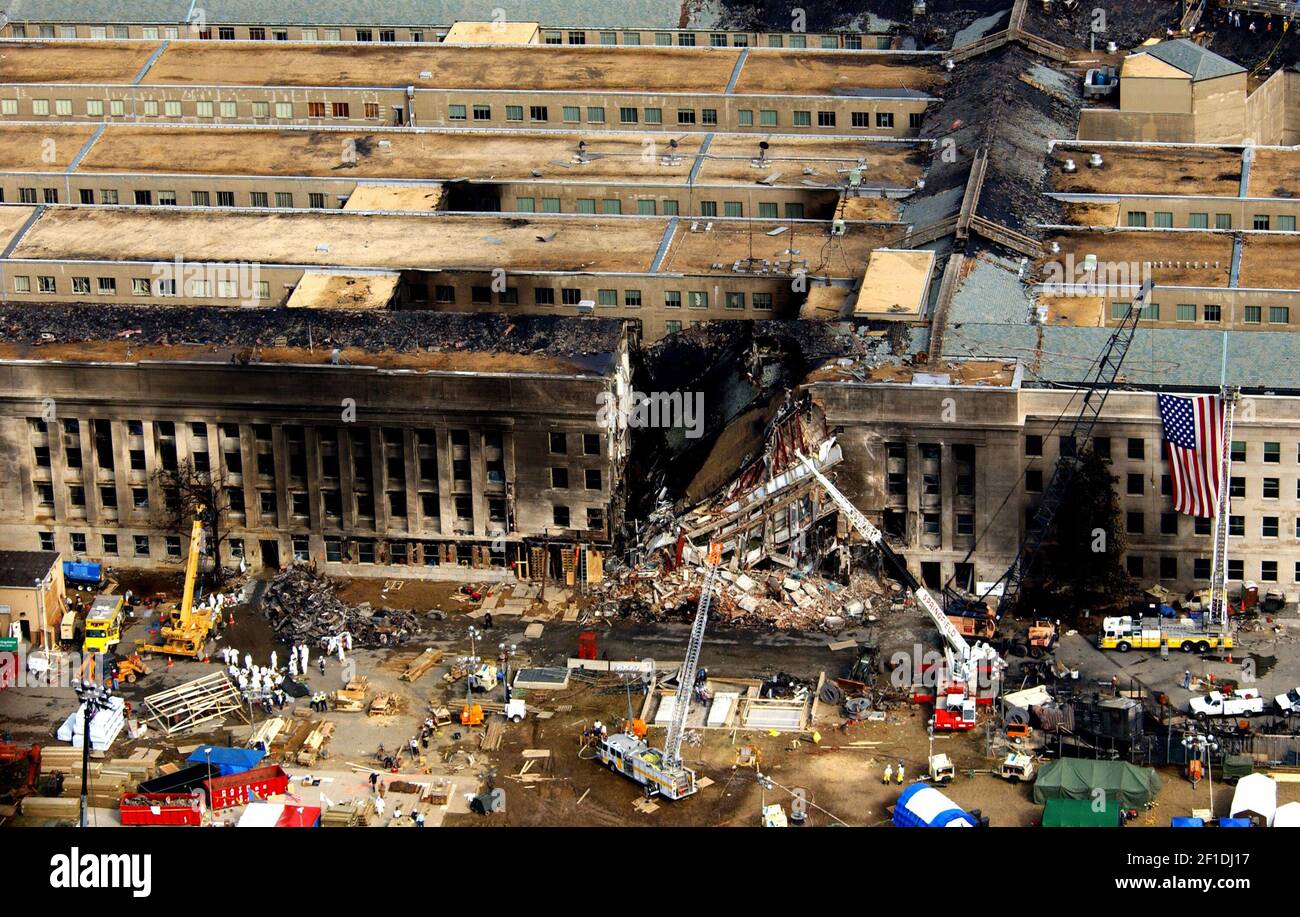 FBI agents, fire fighters, rescue workers and engineers work at the ...