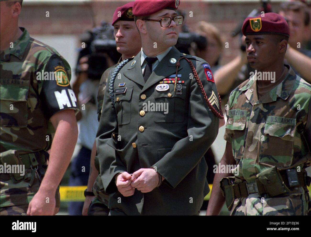 Former Army Sgt. William Kreutzer, center, leaves his courtmartial ...